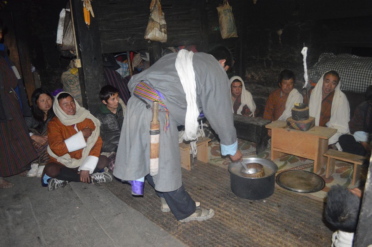 Locals sit in round for marchang offering during lhabon ritual at Taktse village. | Mandala ...