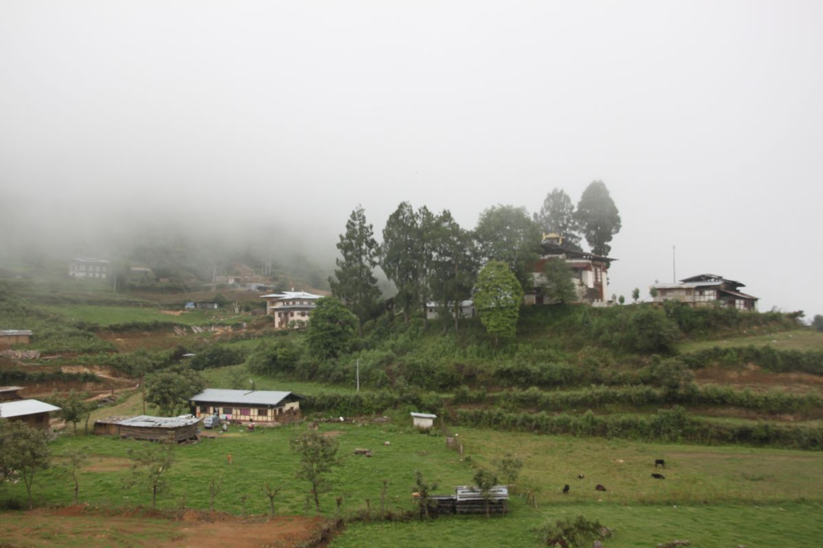 The Taktse Tangchen temple is surrounded by village houses. | Mandala Collections - Images