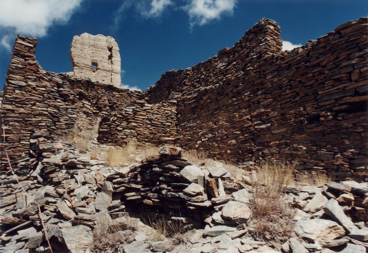 The tall stone and rammed-earth walls. | Mandala Collections - Images